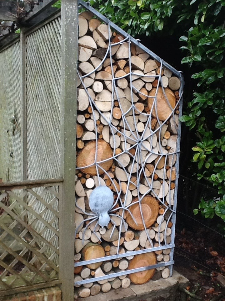 Spider web log store - Norfolk Blacksmith